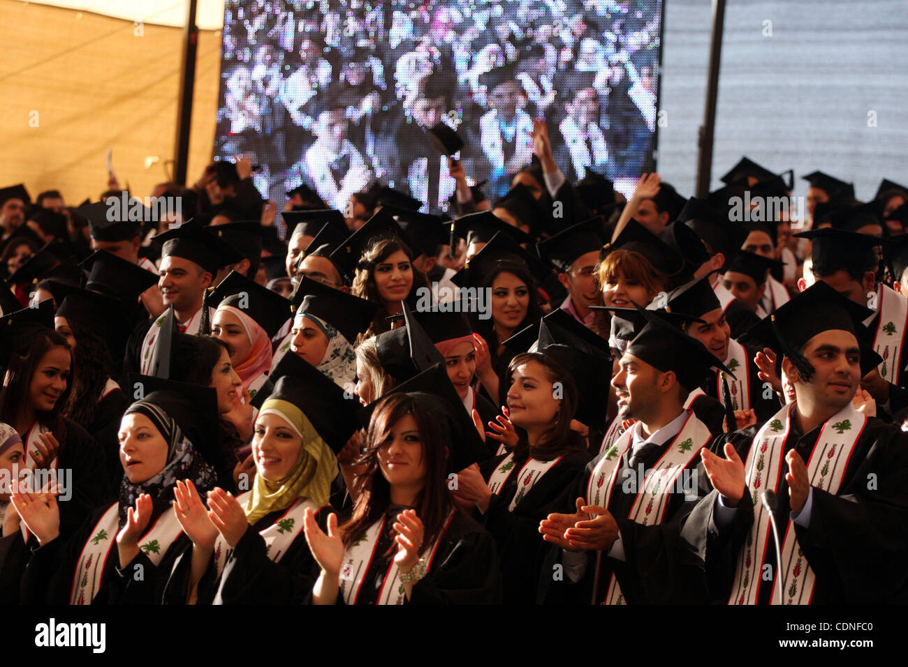 Palestinian students attend their graduation ceremony in Birzeit ...