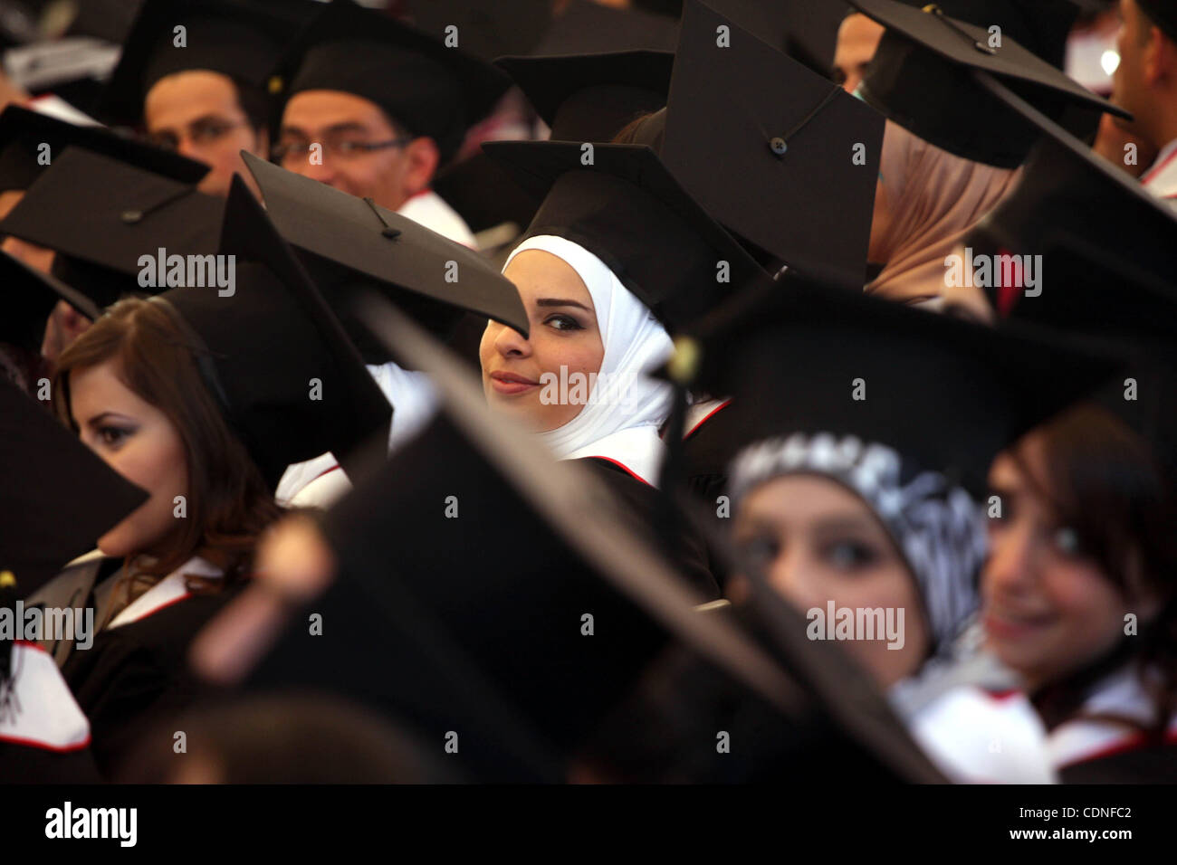 Palestinian students attend their graduation ceremony in Birzeit ...