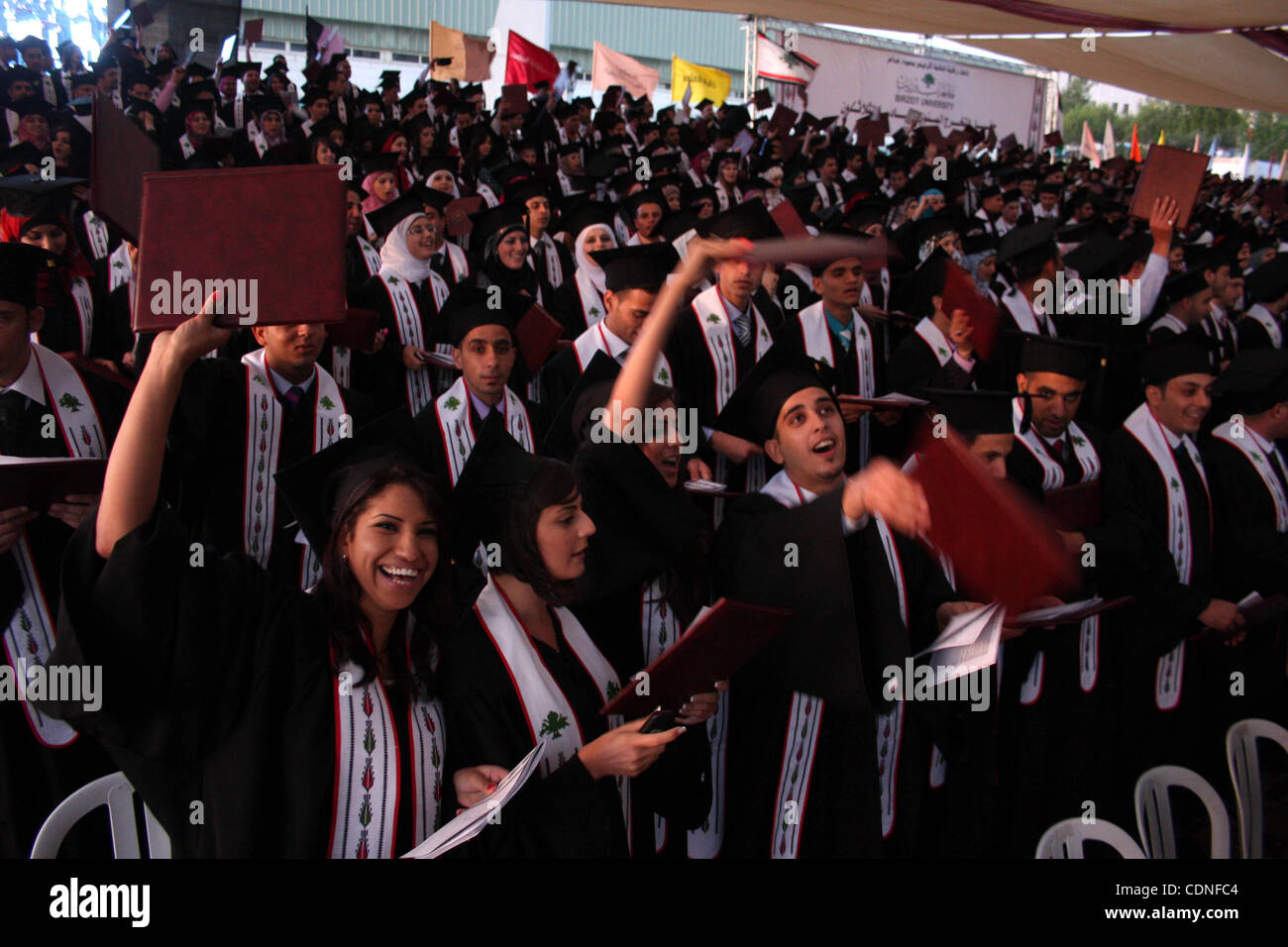 Palestinian students attend their graduation ceremony in Birzeit ...