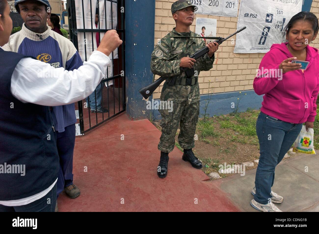 June 5, 2011 - Lima, Lima, Peru - A Peruvian soldier monitors the scene ...