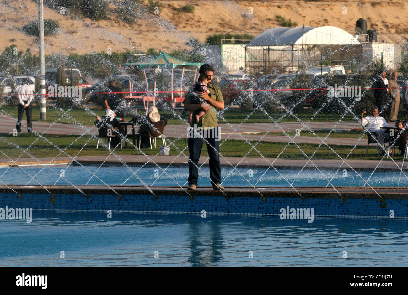 Palestinians enjoy swimming in a pool at the newly-opened "Asda City ...