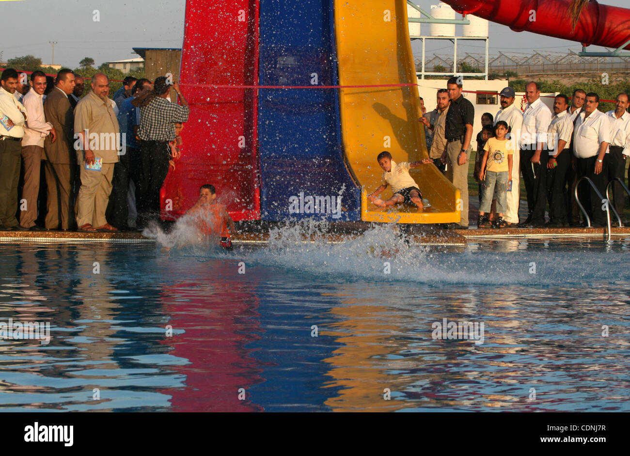 Palestinians enjoy swimming in a pool at the newly-opened "Asda City ...