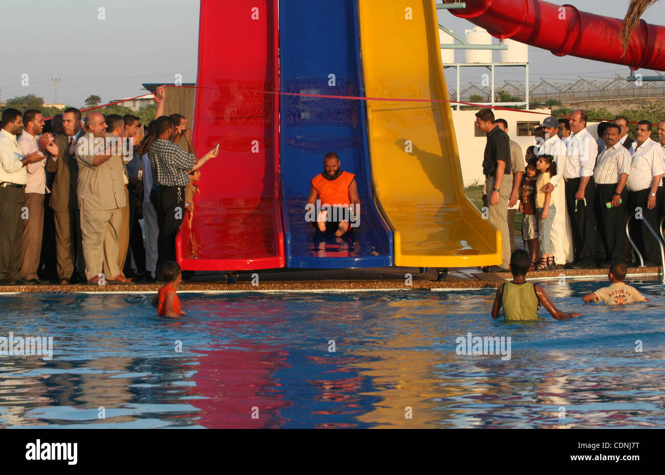 Palestinians enjoy swimming in a pool at the newly-opened "Asda City ...