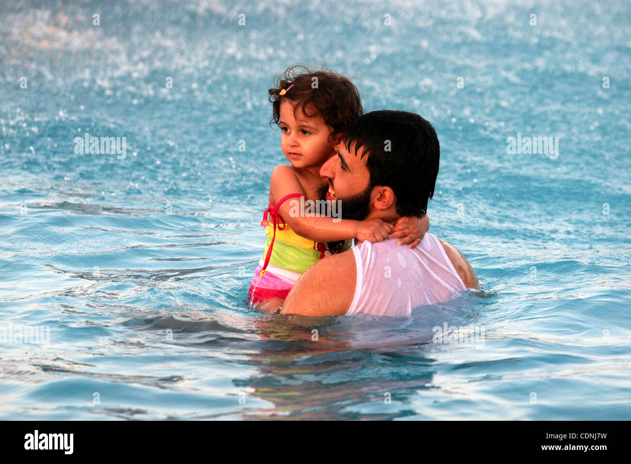 Palestinians enjoy swimming in a pool at the newly-opened "Asda City ...