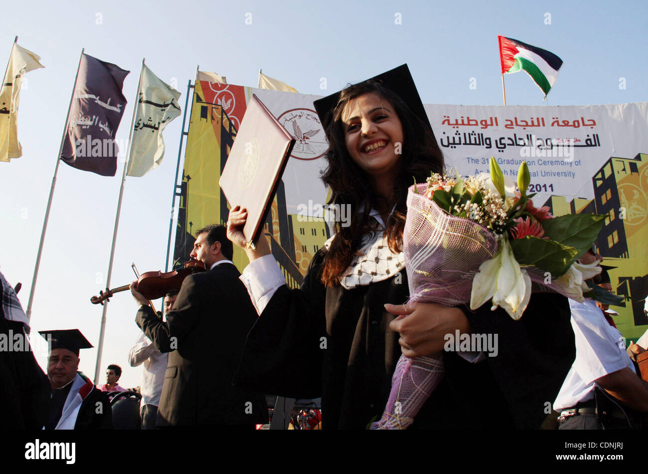 Palestinian students attend a graduation ceremony at the An Najah ...