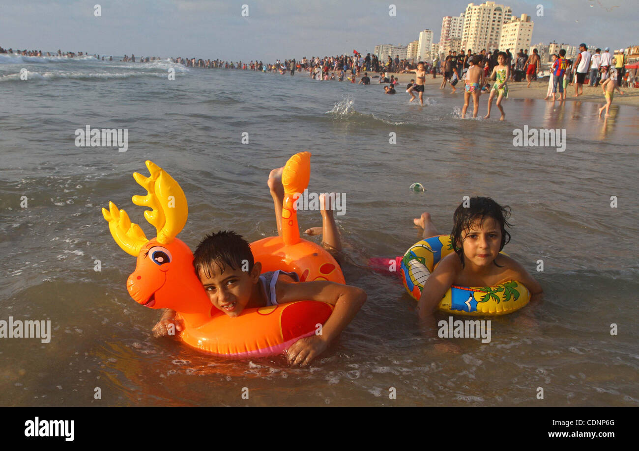 Palestinians enjoy a day at the beach in Gaza City on June 24, 2011 ...