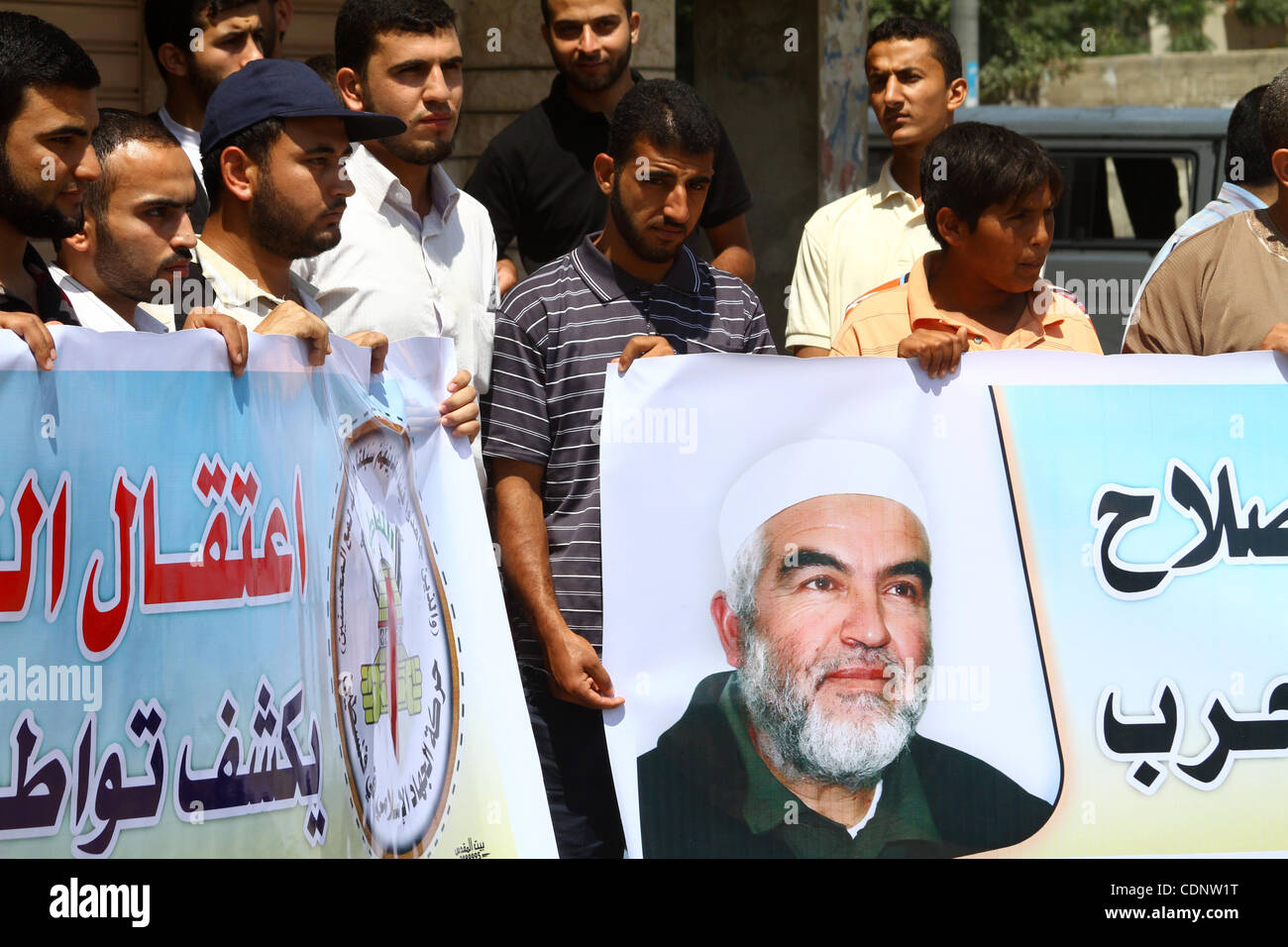 Supporters of Sheikh Raed Salah (portrait), head of the radical wing of ...