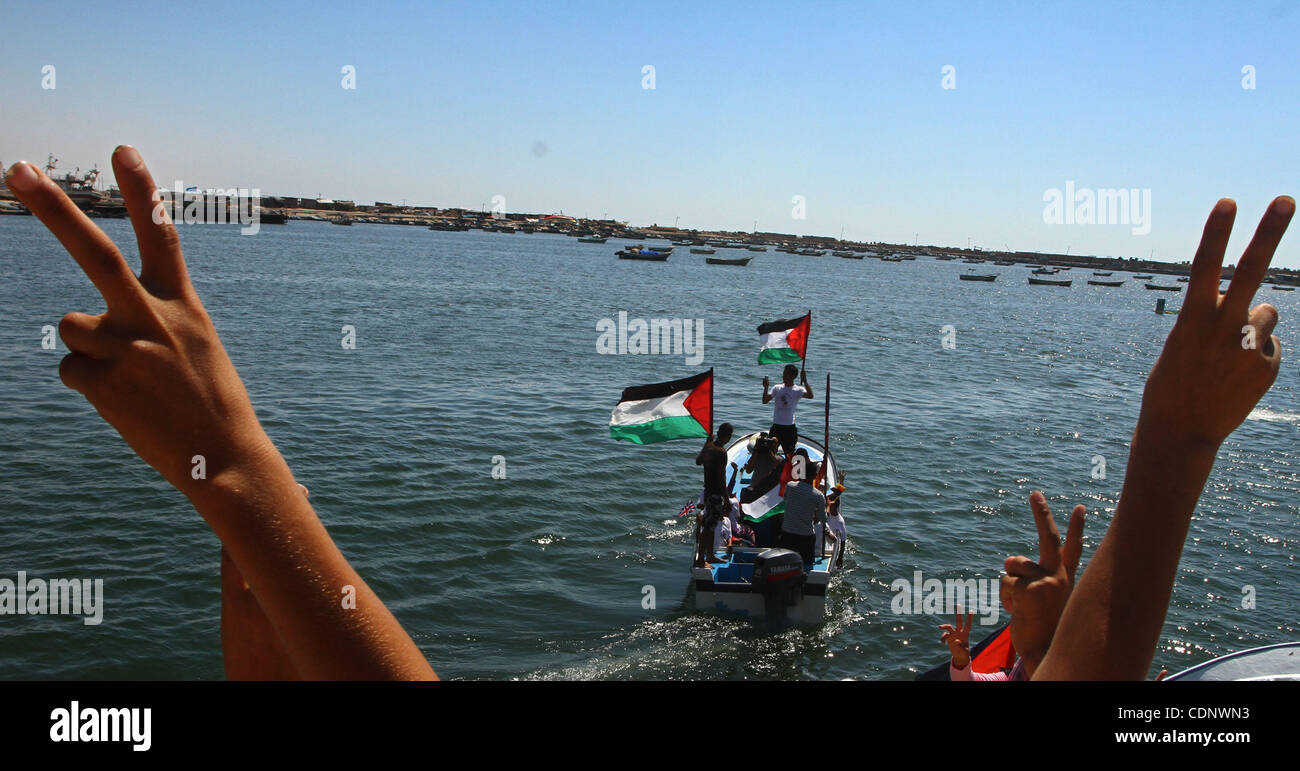 Palestinians ride on boats at the port of Gaza City during a rally in ...