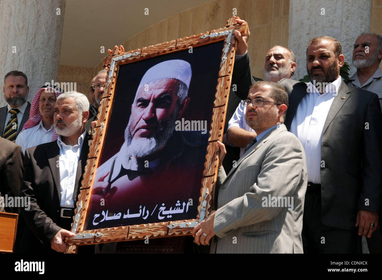 Palestinian Prime Minister in Gaza Strip, Ismail Haniya carries a ...