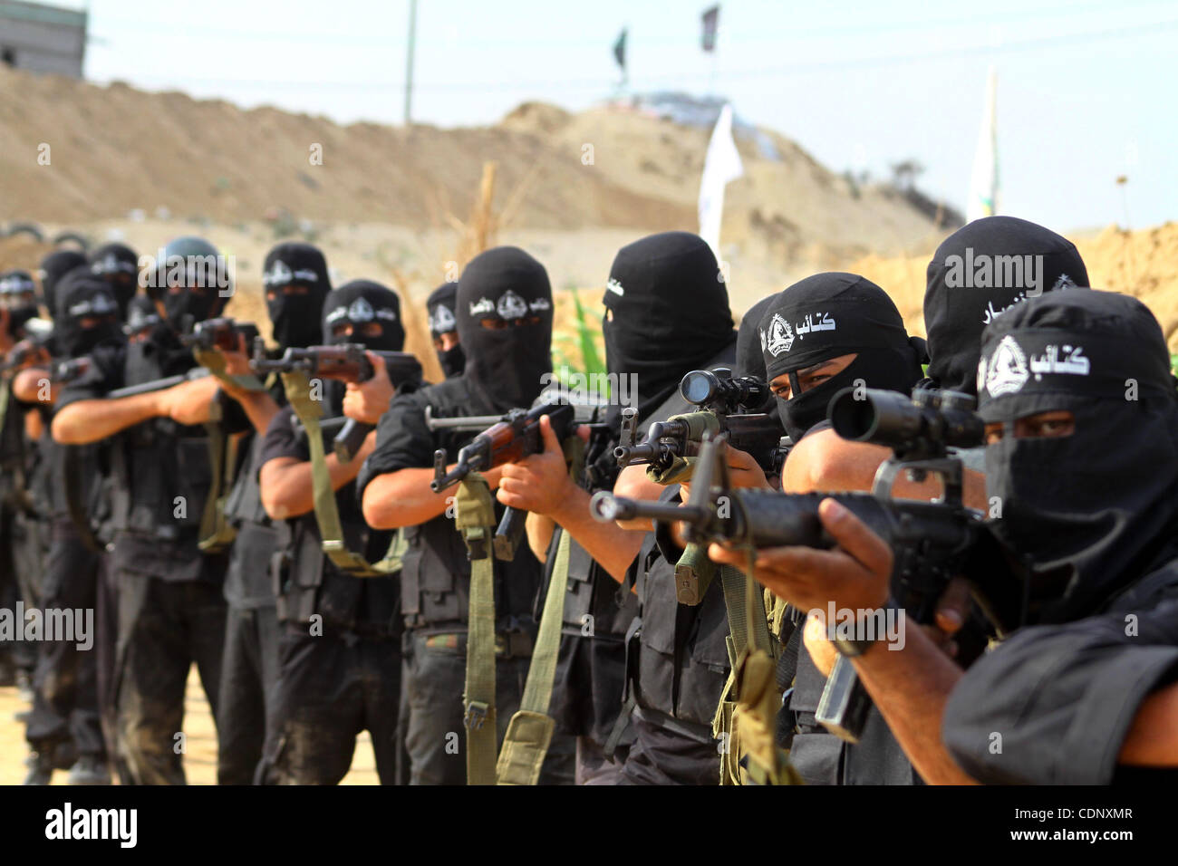 Palestinian militants from Al-Ansar brigades, the armed wing of Al ...