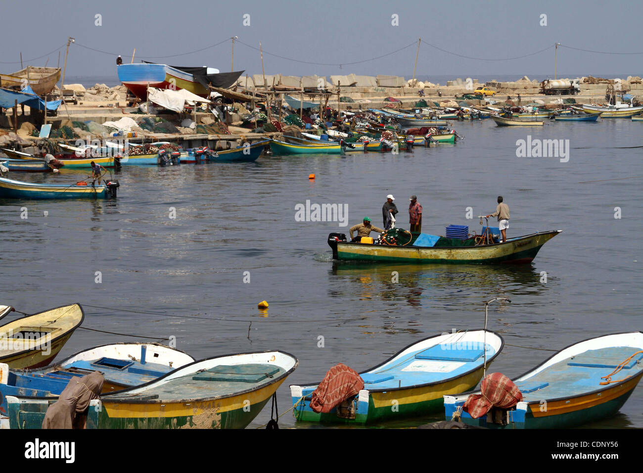 July 07, 2011 - Gaza City, Gaza Strip - Palestinian fishermen ride ...