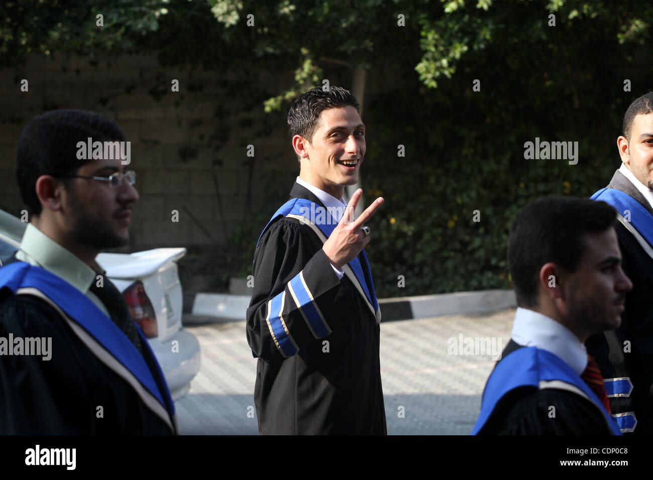 Palestinian students participate in their graduation ceremony at the ...