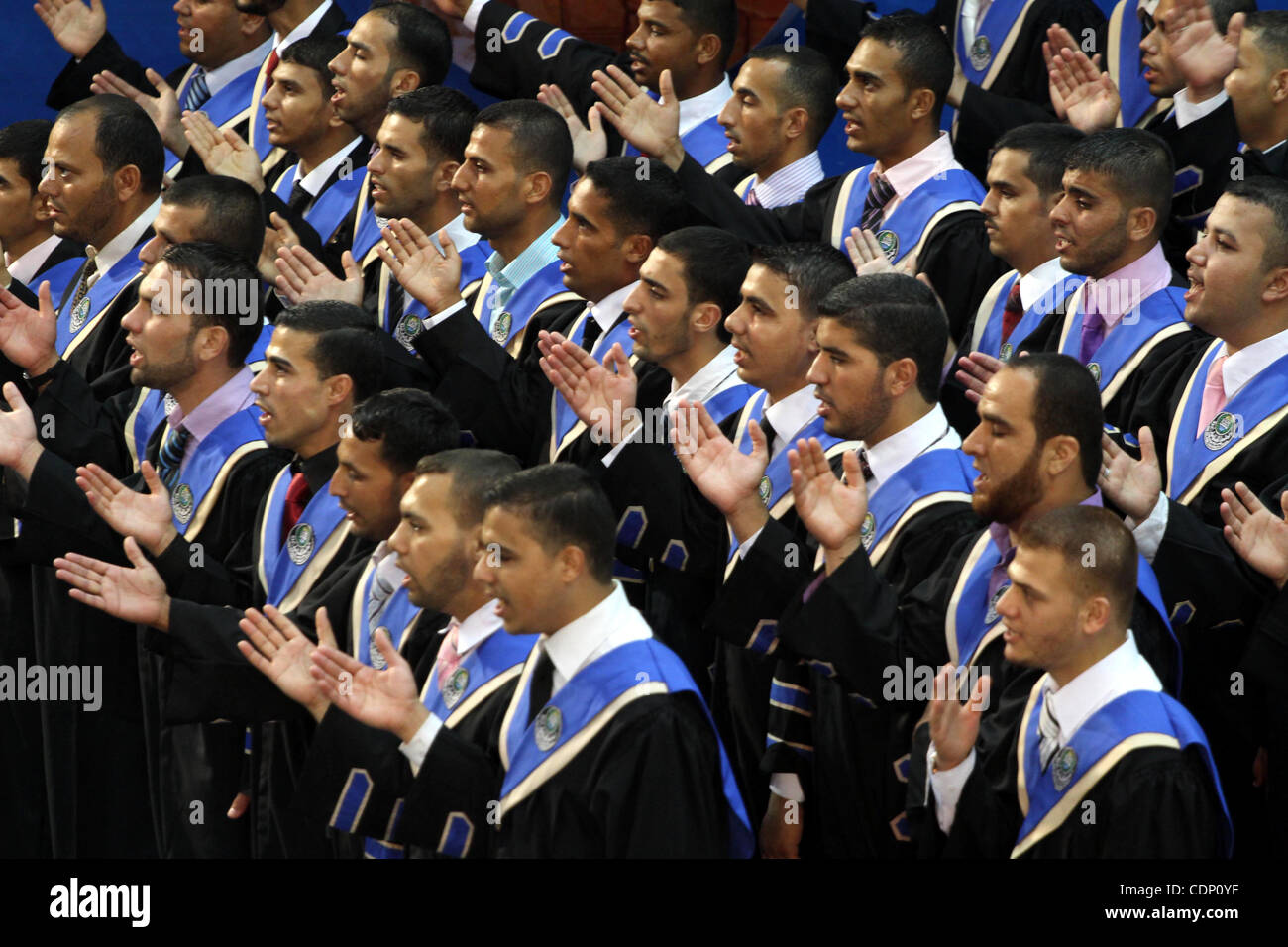 Palestinian students participate in their graduation ceremony at the ...