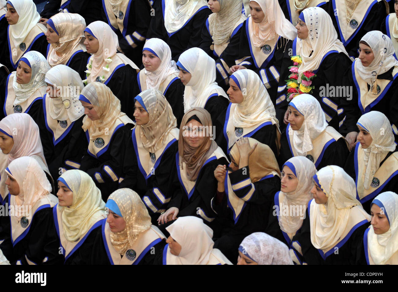 Palestinian students participate in their graduation ceremony at the ...