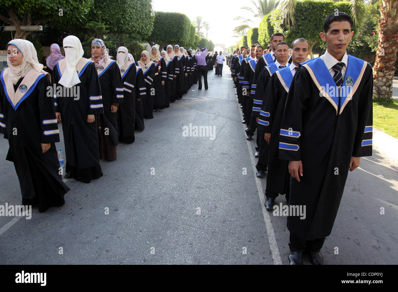 Palestinian students participate in their graduation ceremony at the ...