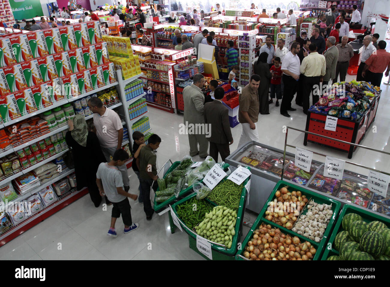 Palestinians shop from the newly opened shopping mall in Gaza City on ...