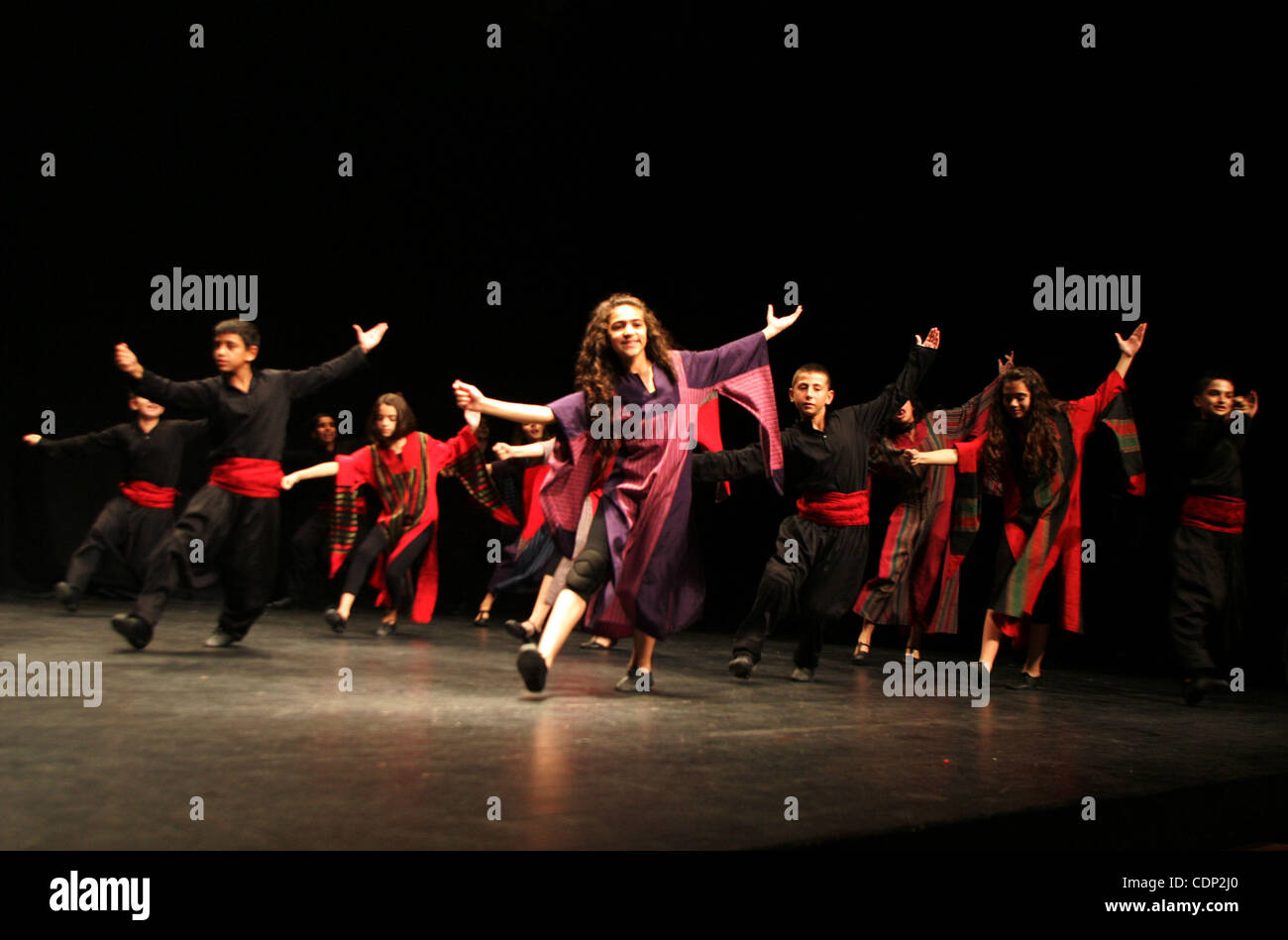 Palestinian children dance the traditional Dabka during a musical ...