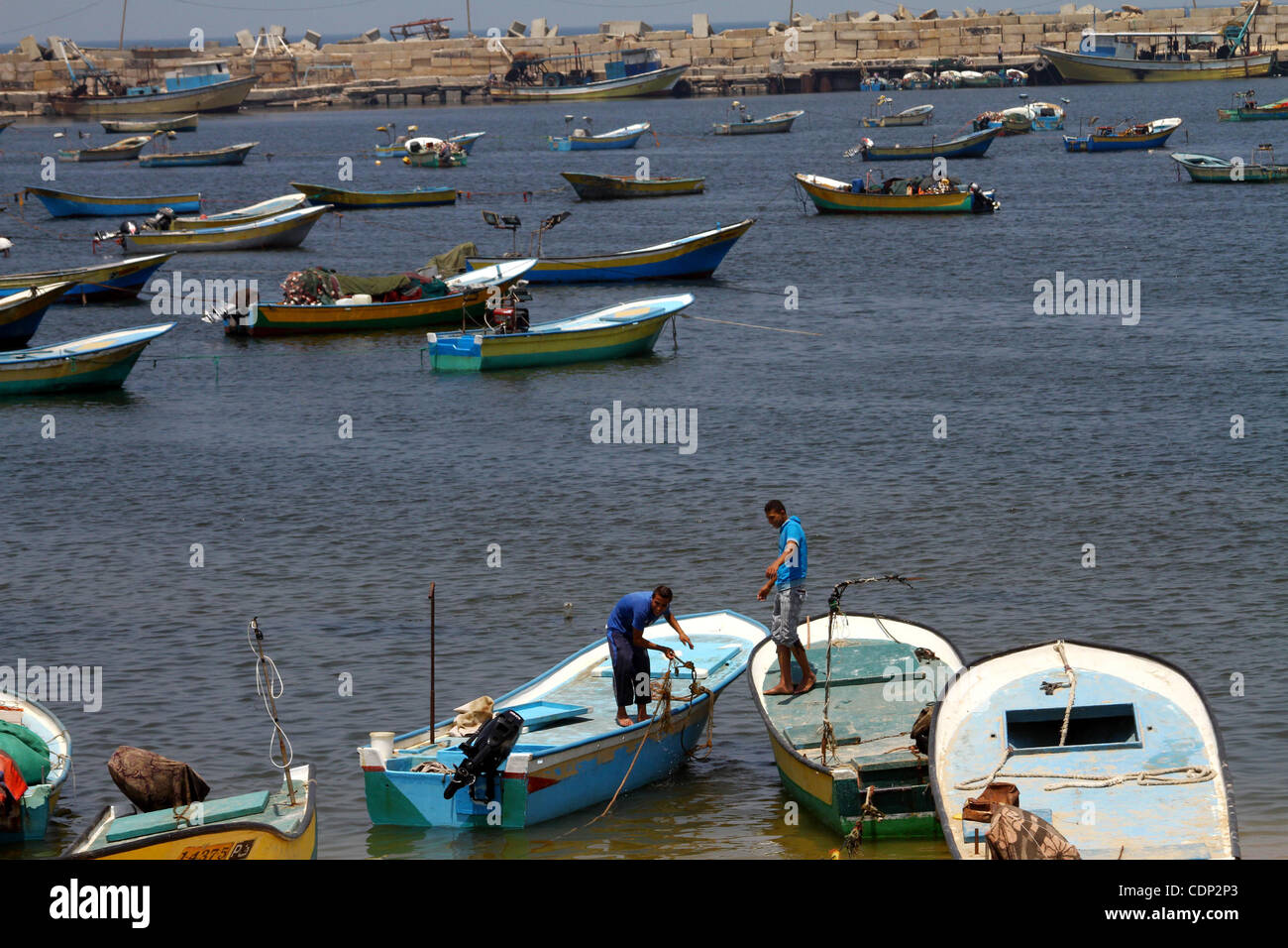 Palestinian fishermen ride a boat at the Gaza seaport on July 19, 2011 ...