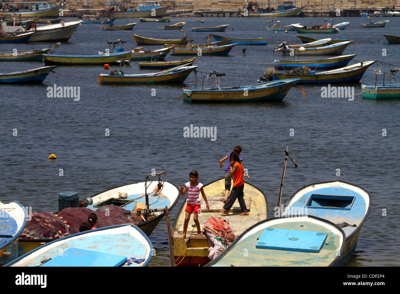 Palestinian children enjoy playing on a boat at the Gaza seaport July ...