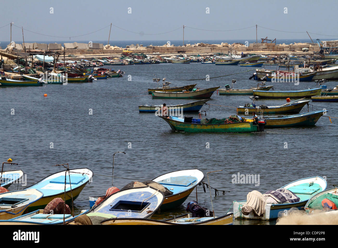 Palestinian fishermen ride a boat at the Gaza seaport on July 19, 2011 ...