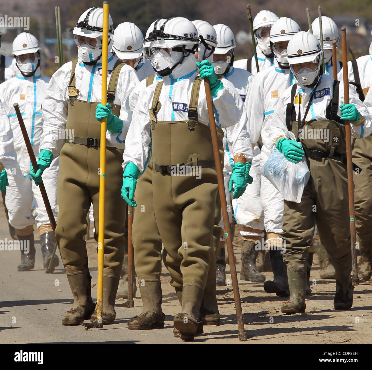 Apr. 17, 2011 - Namie, Japan - Police officers wearing the radiation ...