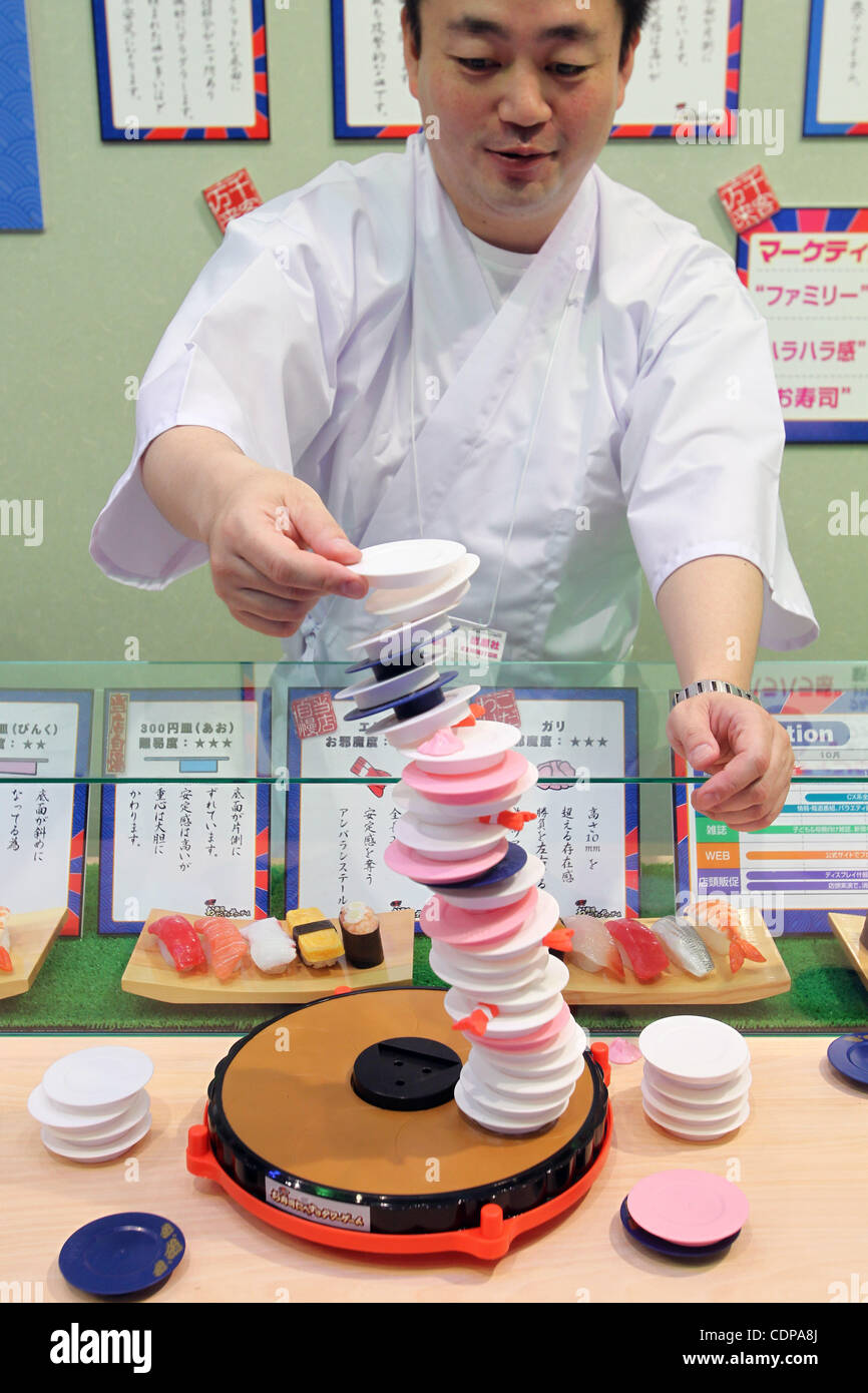 June 16, 2011 - Tokyo, Japan - Plate-towering game of sushi-go-round is ...