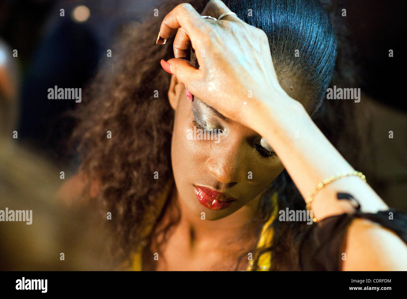 July 07, 2011 - Dakar, Senegal - A model receives touch-ups to her make ...