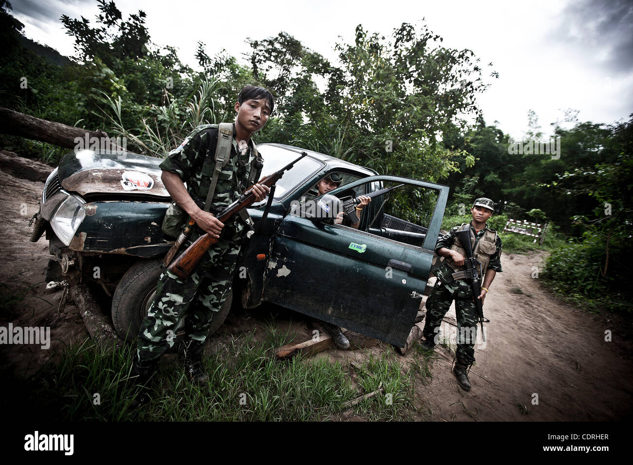 An abandoned car marks the burmese/thai border line check point where ...