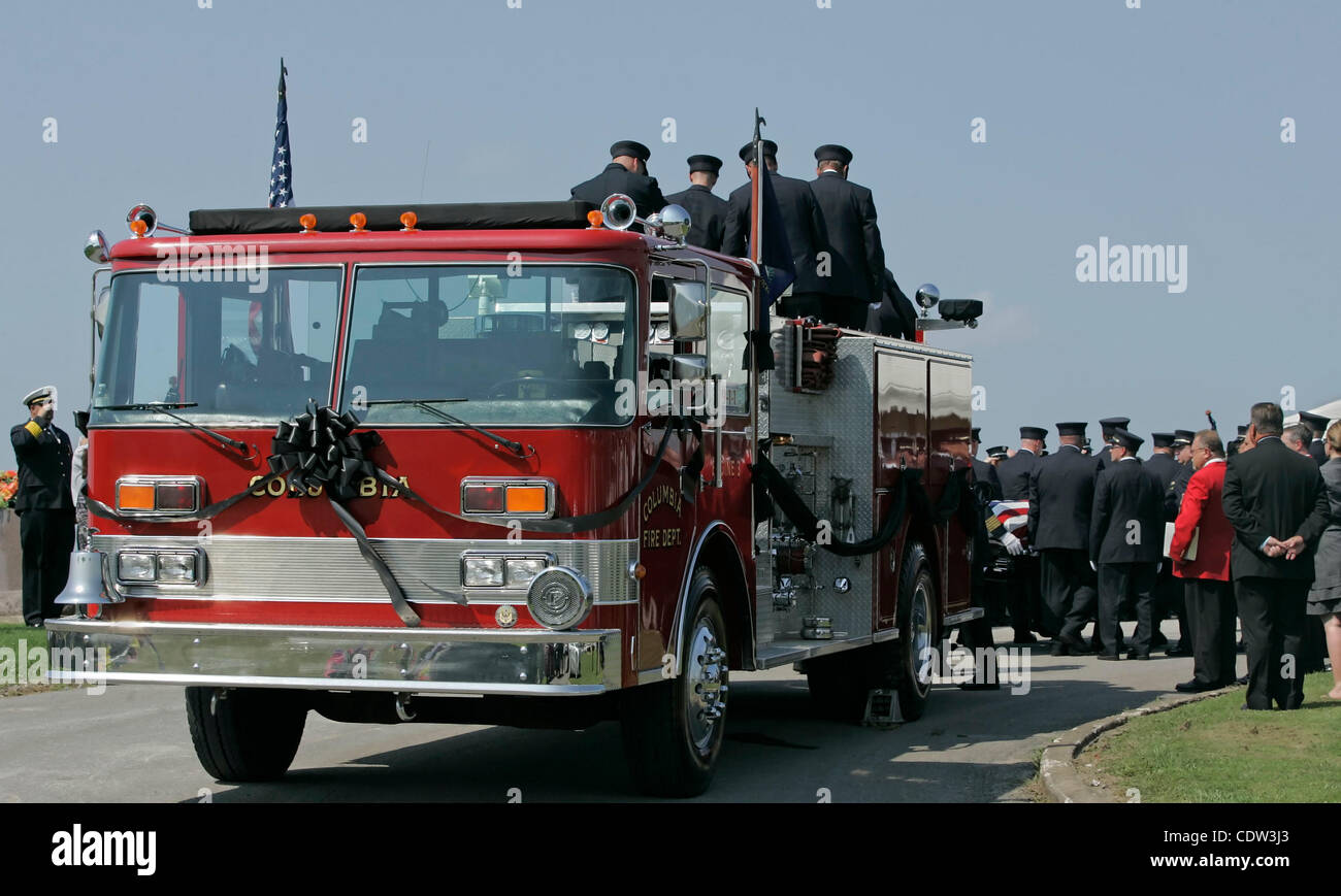 Columbia-Adair County Fire Department volunteer firefighters carry the ...