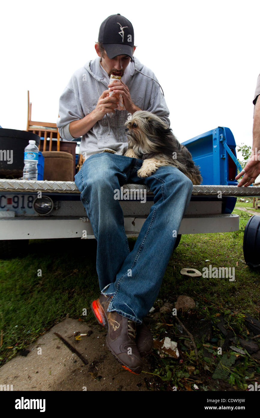 Daniel from Joplin, Missouri sits on the tailgate of his father's truck ...