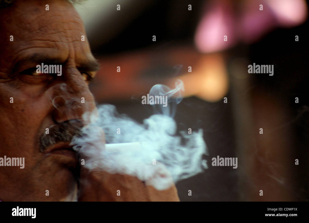 May 31, 2011 - Srinagar, Kashmir, India - A Kashmiri taking a puff of a ...