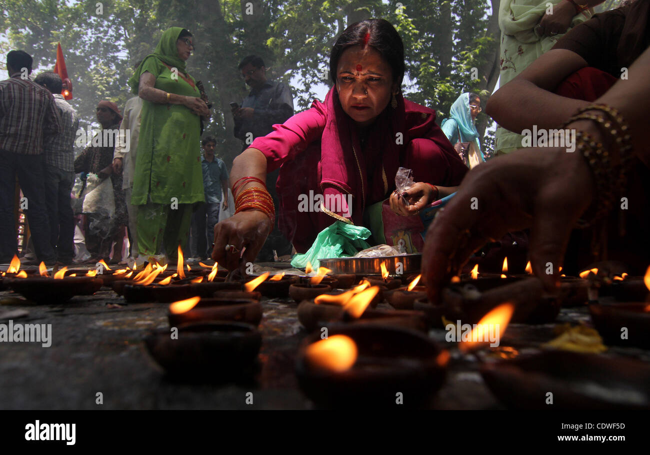Kashmiri pandit (Hindu) devotee offers prayers at the Kheer Bhawani ...