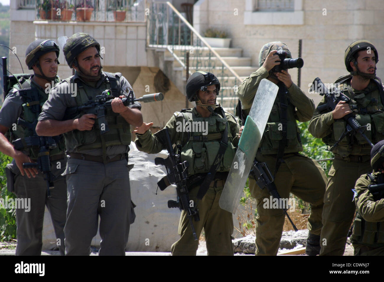 Israeli soldiers take position during a demonstration by Palestinian ...
