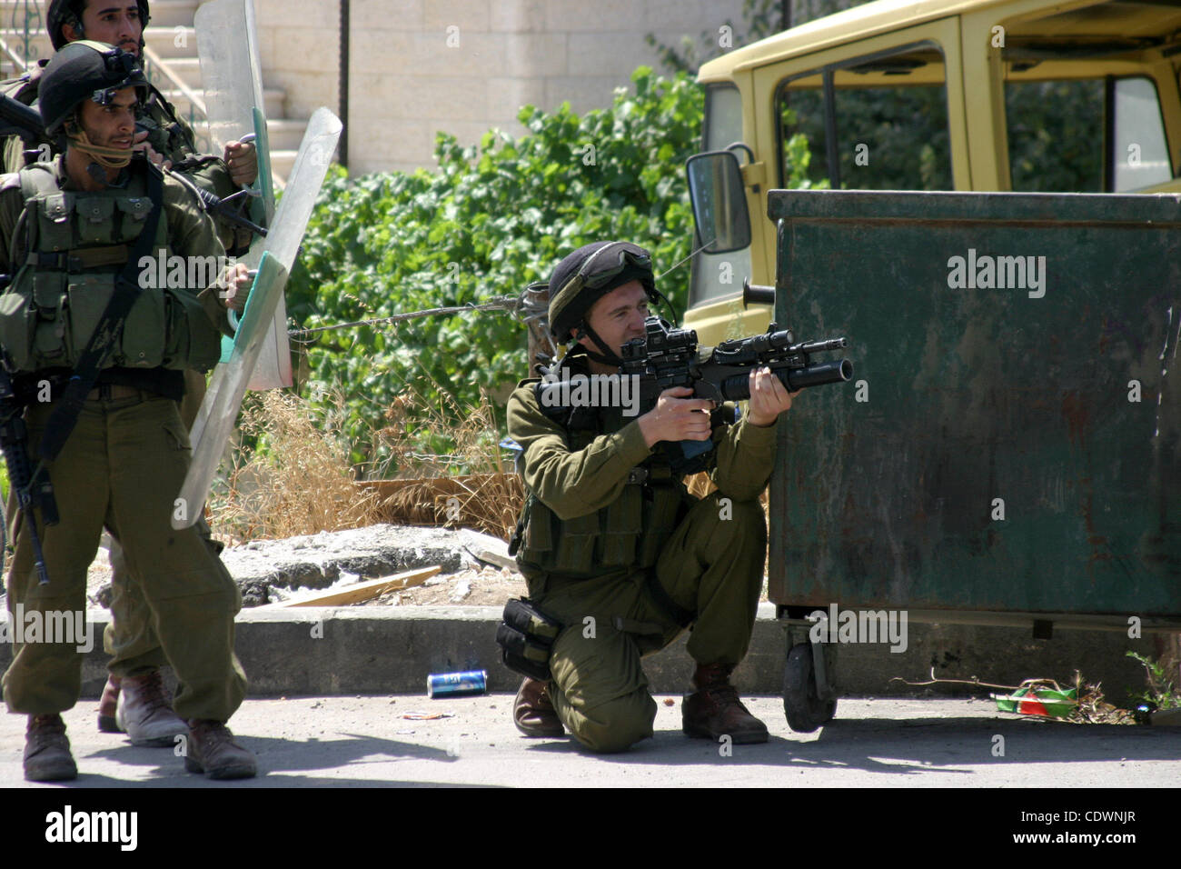 Israeli soldiers take position during a demonstration by Palestinian ...