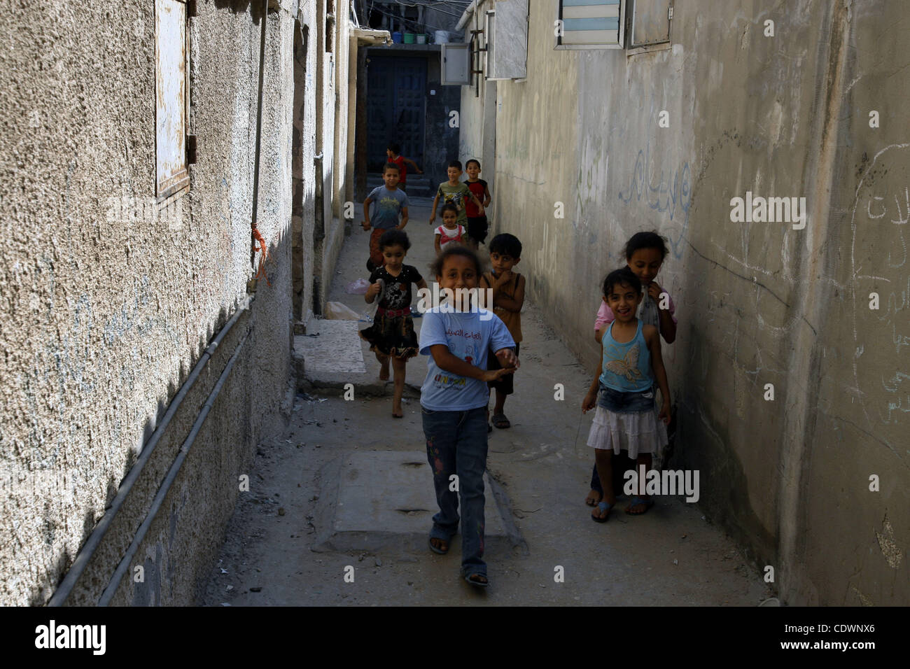 Palestinian children play in front of their house Al Shate` refugee ...