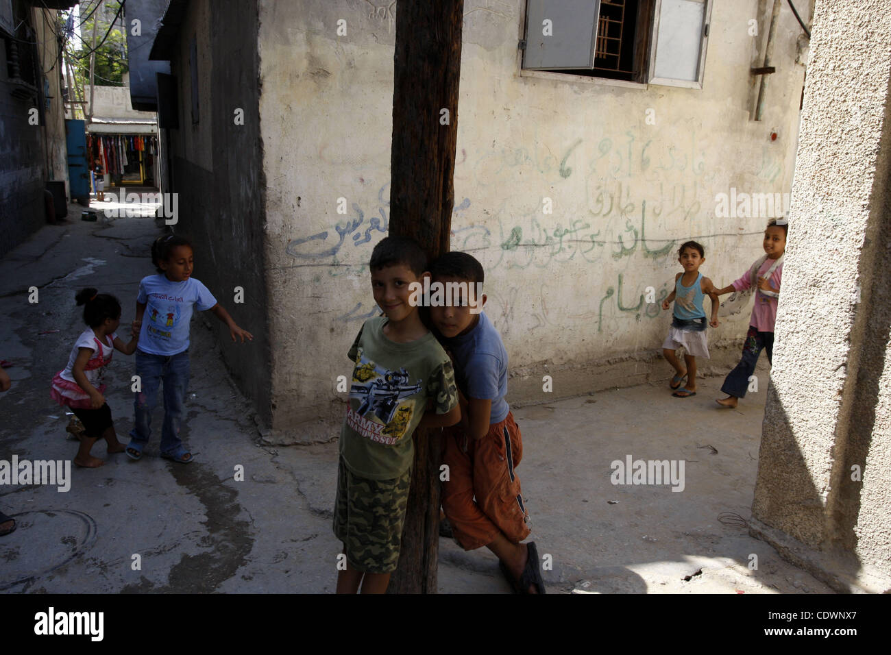 Palestinian children play in front of their house Al Shate` refugee ...