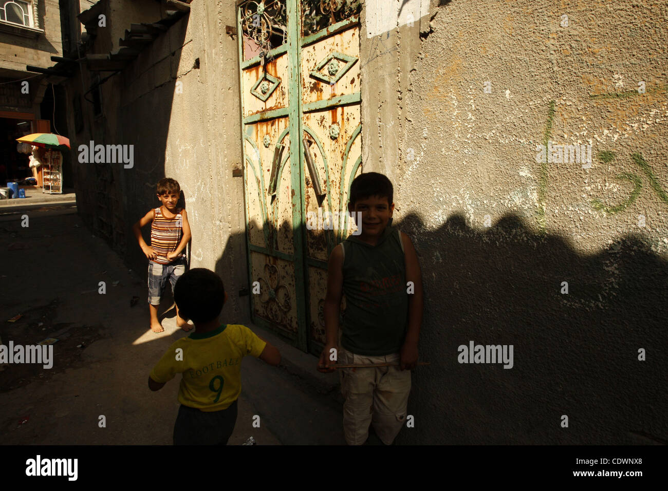 Palestinian children play in front of their house Al Shate` refugee ...