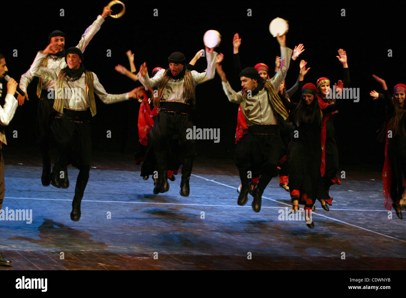 Palestinian folklore dance troupe perform during an annual cultural ...