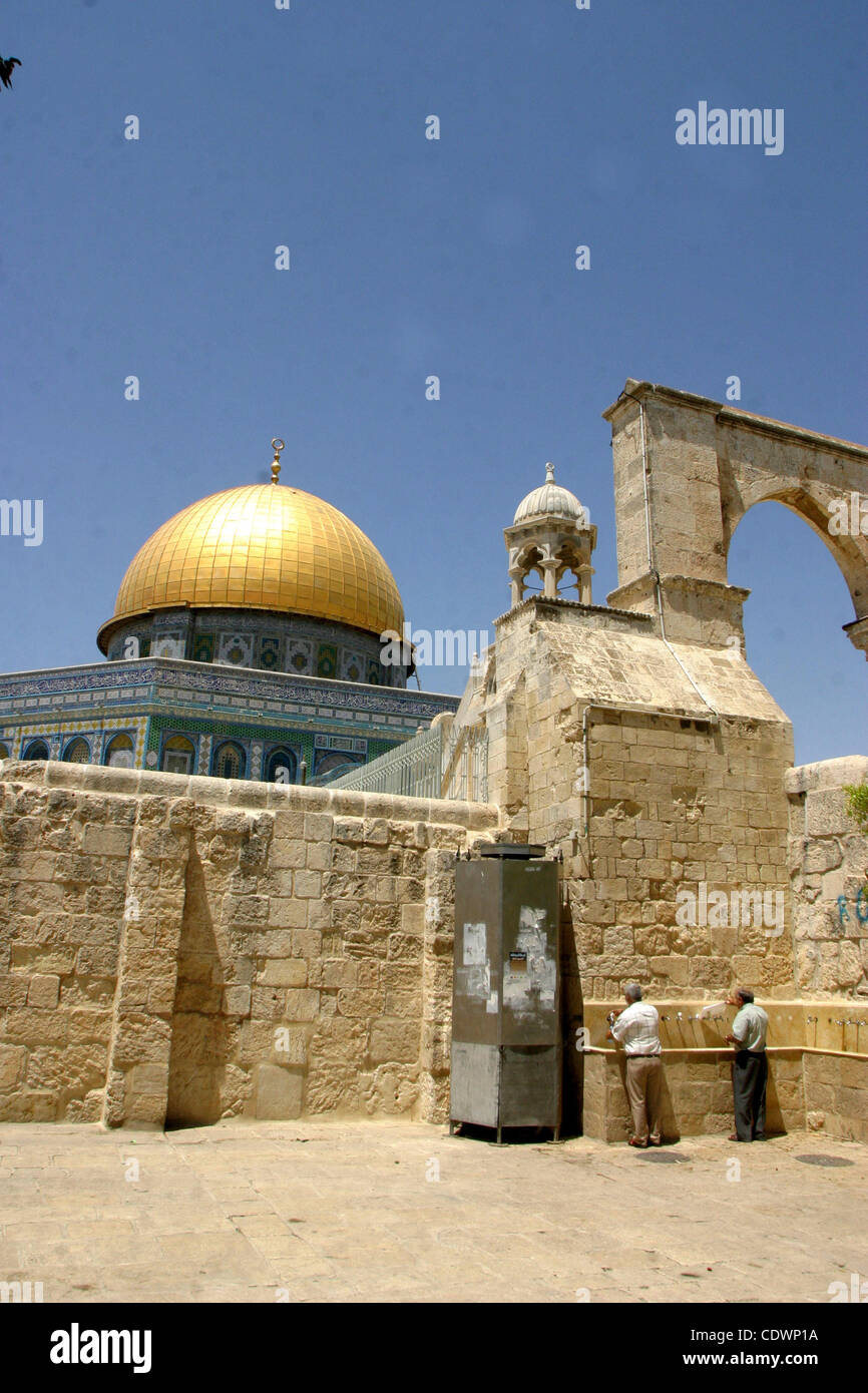 A Palestinian Muslims stand in the yards of al Aqsa Mosque, after al ...