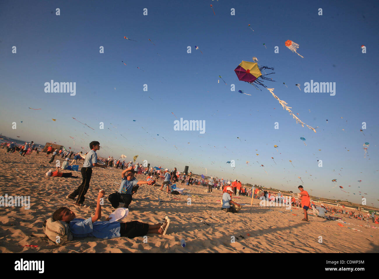 Palestinian children fly kites during an event organized by the United ...