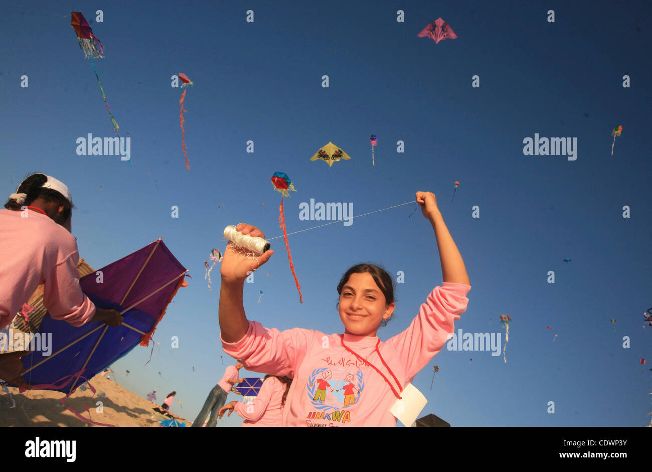 Palestinian children fly kites during an event organized by the United ...