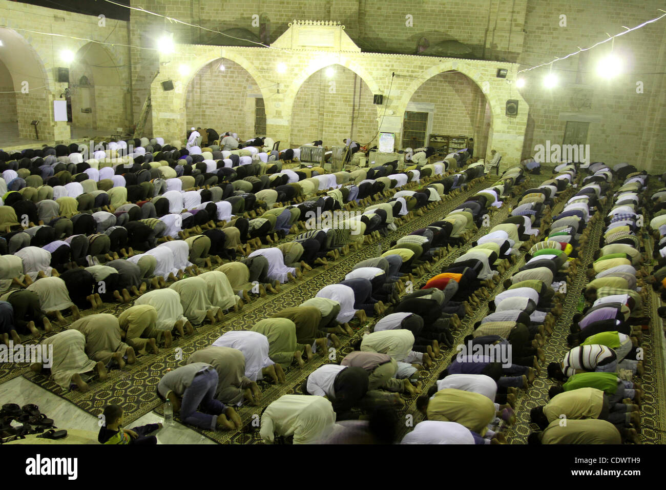 Palestinian Muslims pray al-Taraweeh prayer at al-Omari Mosque during ...