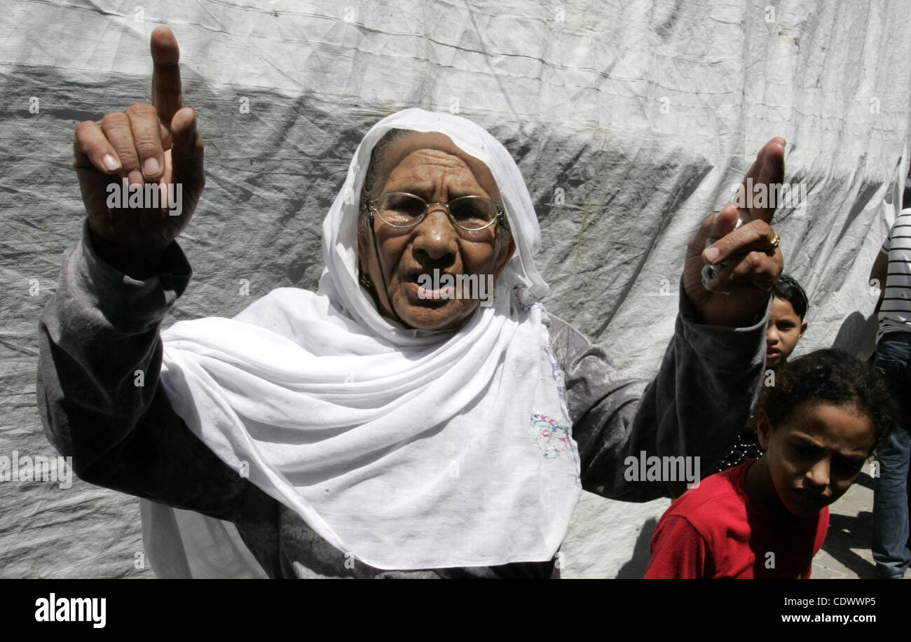 A relative of Palestinian Hisham Abu Harb mourns during his funeral in ...
