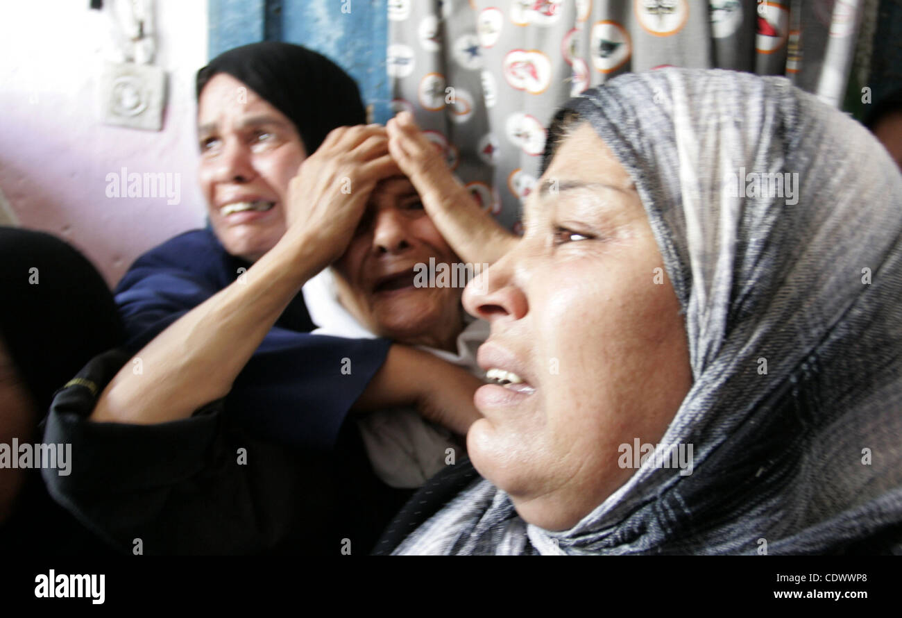 Relatives of Palestinian Hisham Abu Harb mourn during his funeral in ...