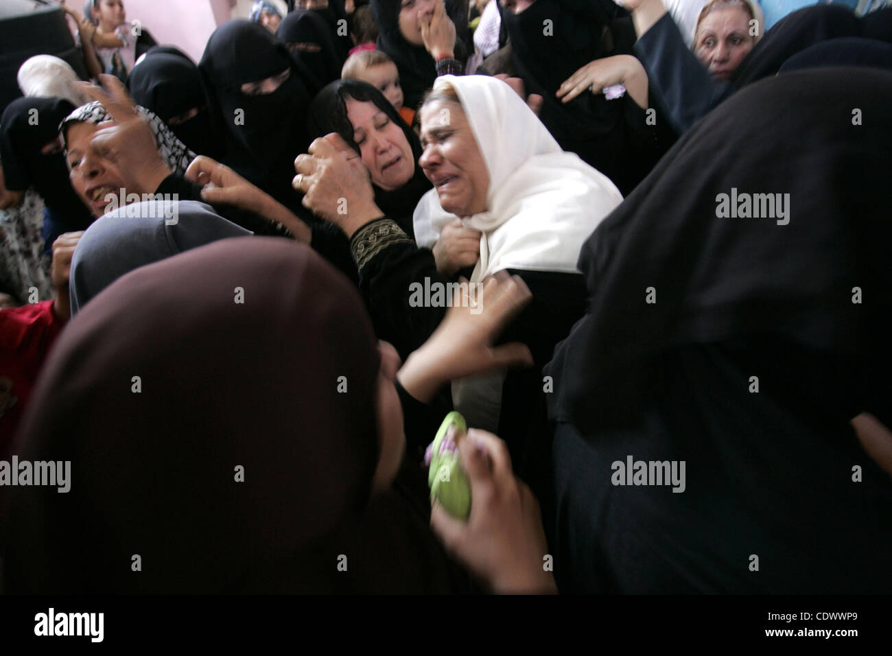 Relatives of Palestinian Hisham Abu Harb mourn during his funeral in ...