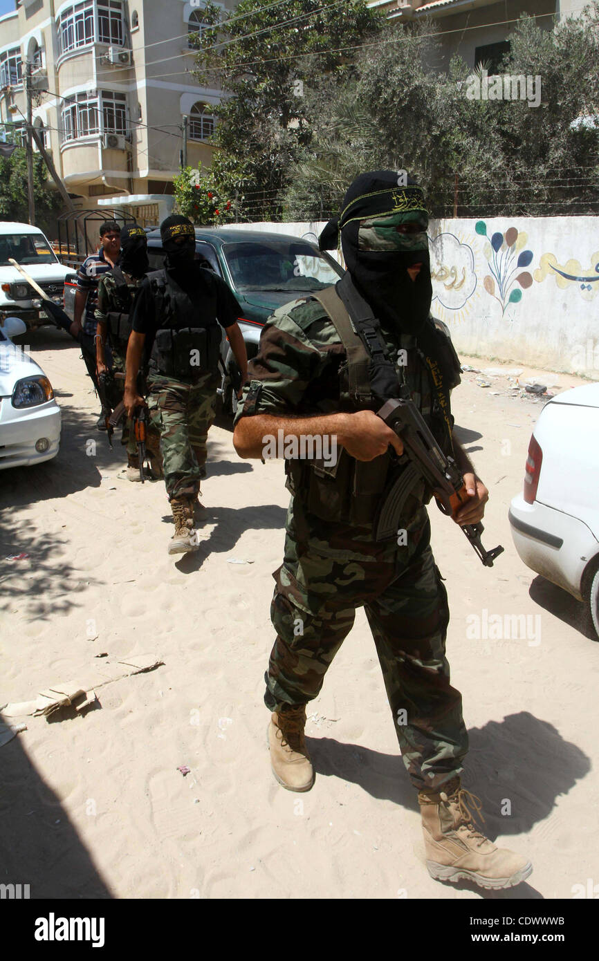 Palestinian militants of Islamic Jihad take part in the funeral of Alaa ...