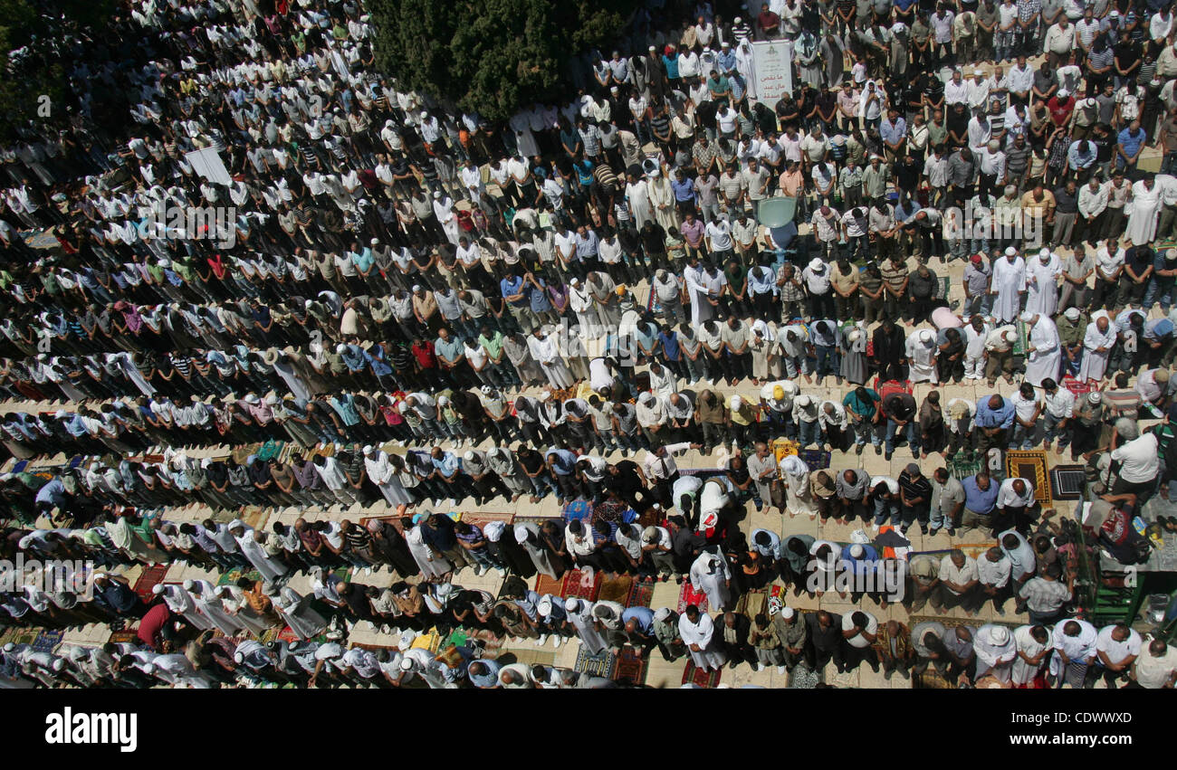 Muslims pray outside the Dome of the Rock mosque situated in the al ...