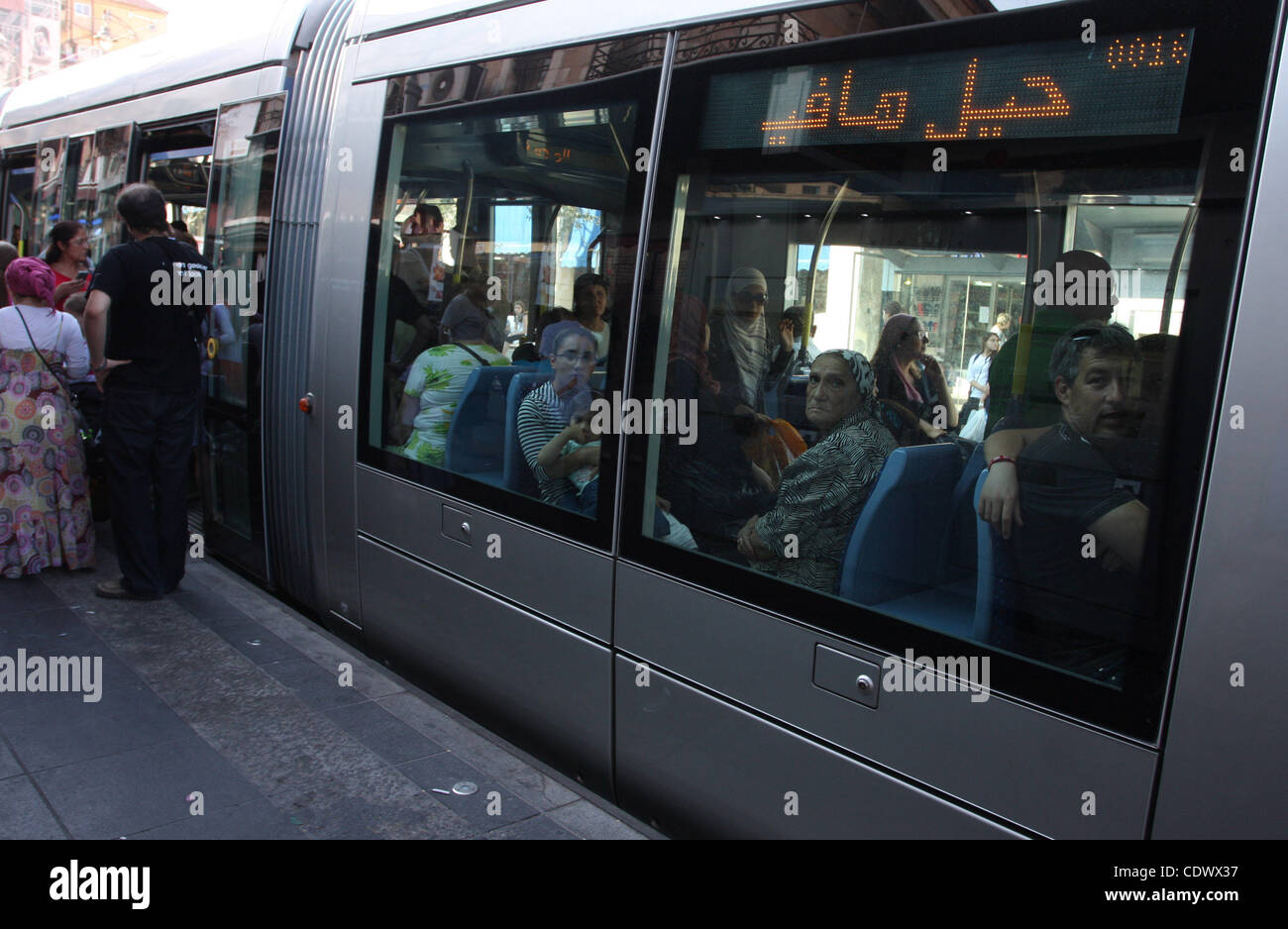 Palestinian and israeli Passengers ride a light rail train, Ten days ...