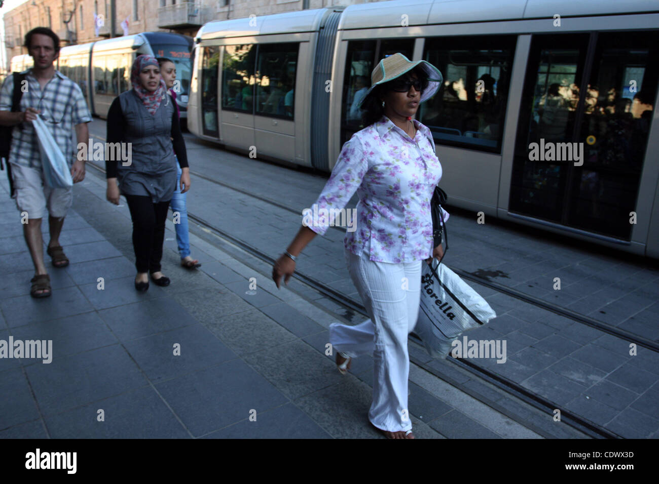 Palestinian and israeli Passengers ride a light rail train, Ten days ...