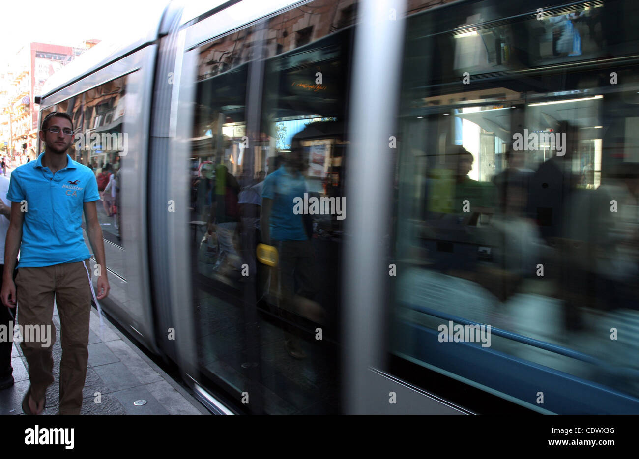 Palestinian and israeli Passengers ride a light rail train, Ten days ...